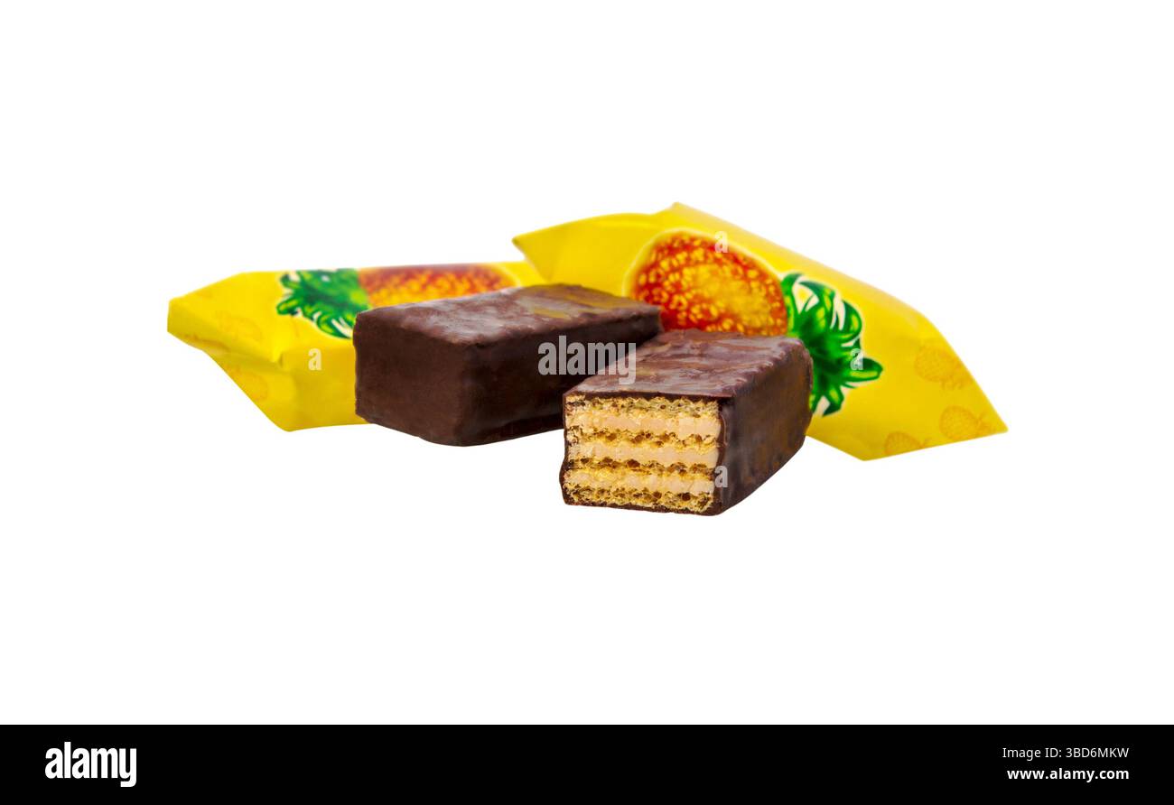Chocolate candy stuffed with crispy wafers and caramel isolated on a ...