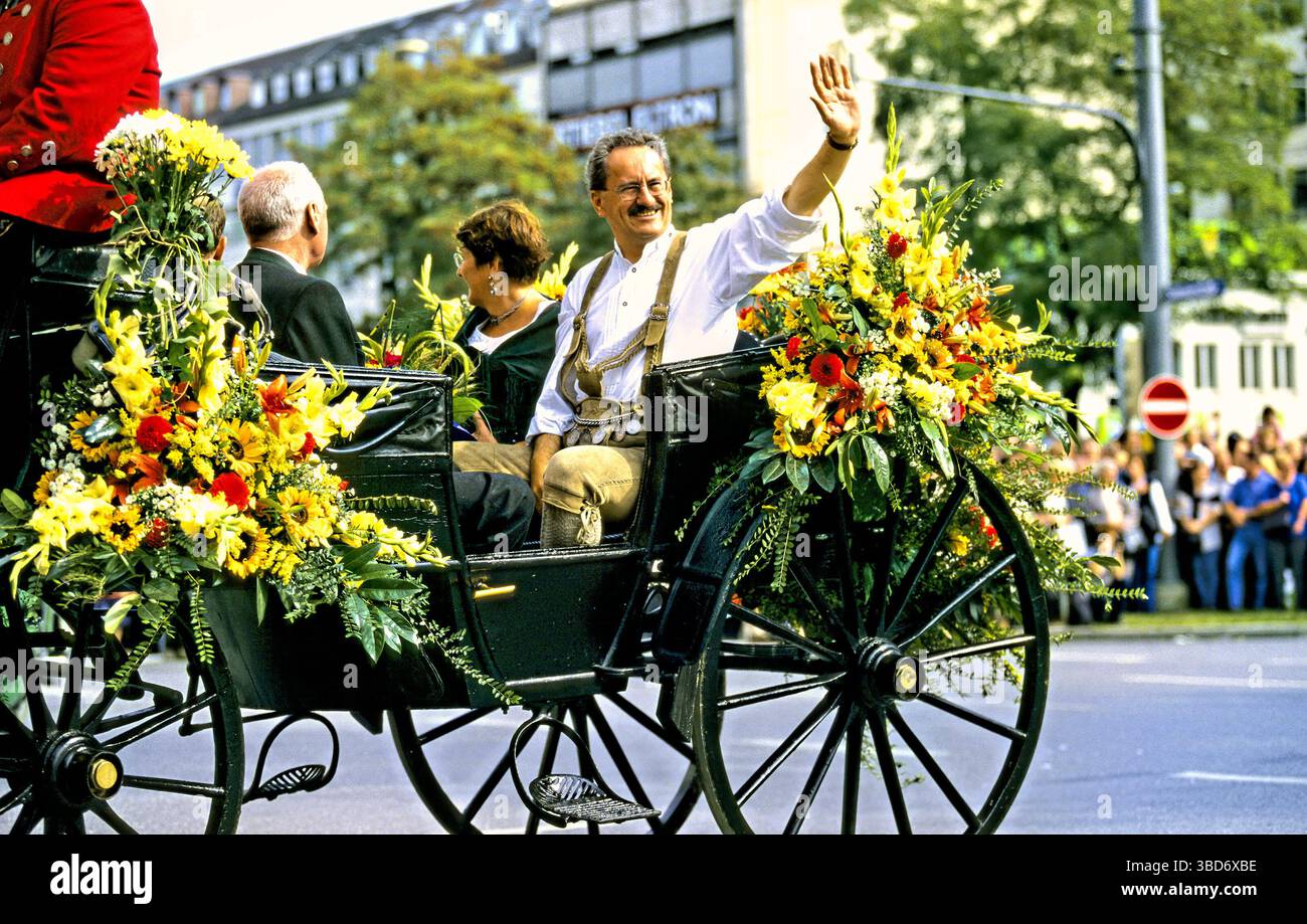 Christian Ude, Mayor of Munich, with his wife, riding in a horse ...