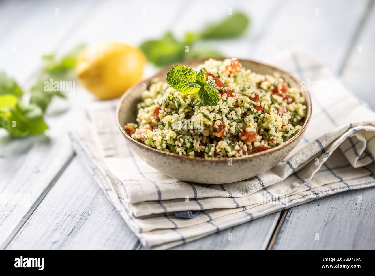 Traditional Tabouleh salad with bulgur, parsley, cucumber, tomato ...