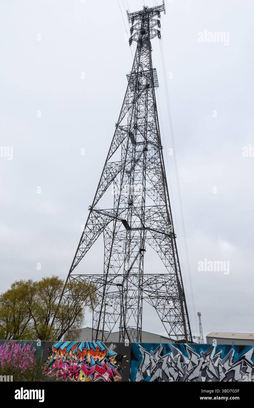 Extra tall electricity pylon on the north bank of the River Thames ...