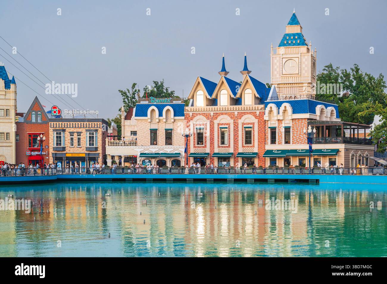 Tourist square with architectural buildings and castles by lake in ...