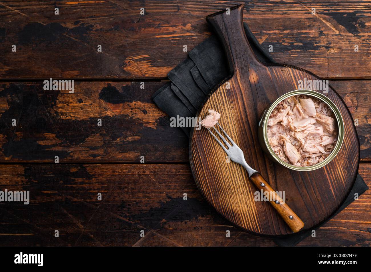 Freshly opened tinned canned tuna, showcasing its rich texture and ...
