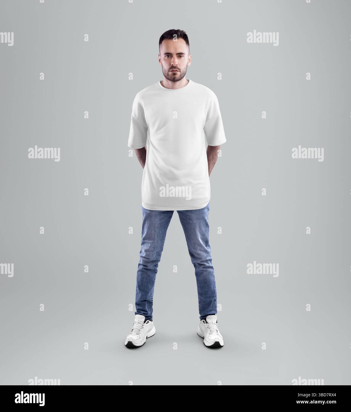 Mockup of white oversized t-shirt on bearded man in blue jeans, hands ...