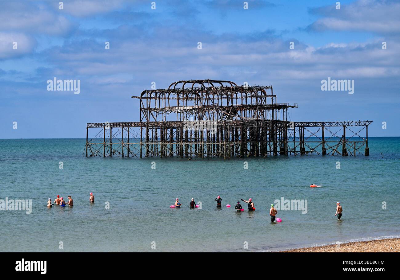 Early morning sea swimmers off Brighton beach by the West Pier May 2025 ...