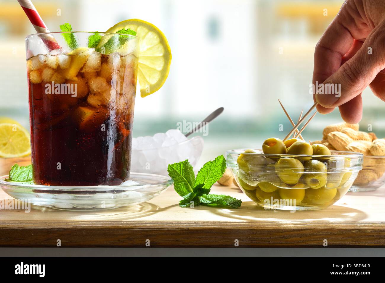 Having a snack in a kitchen with a wooden bench full of containers with ...