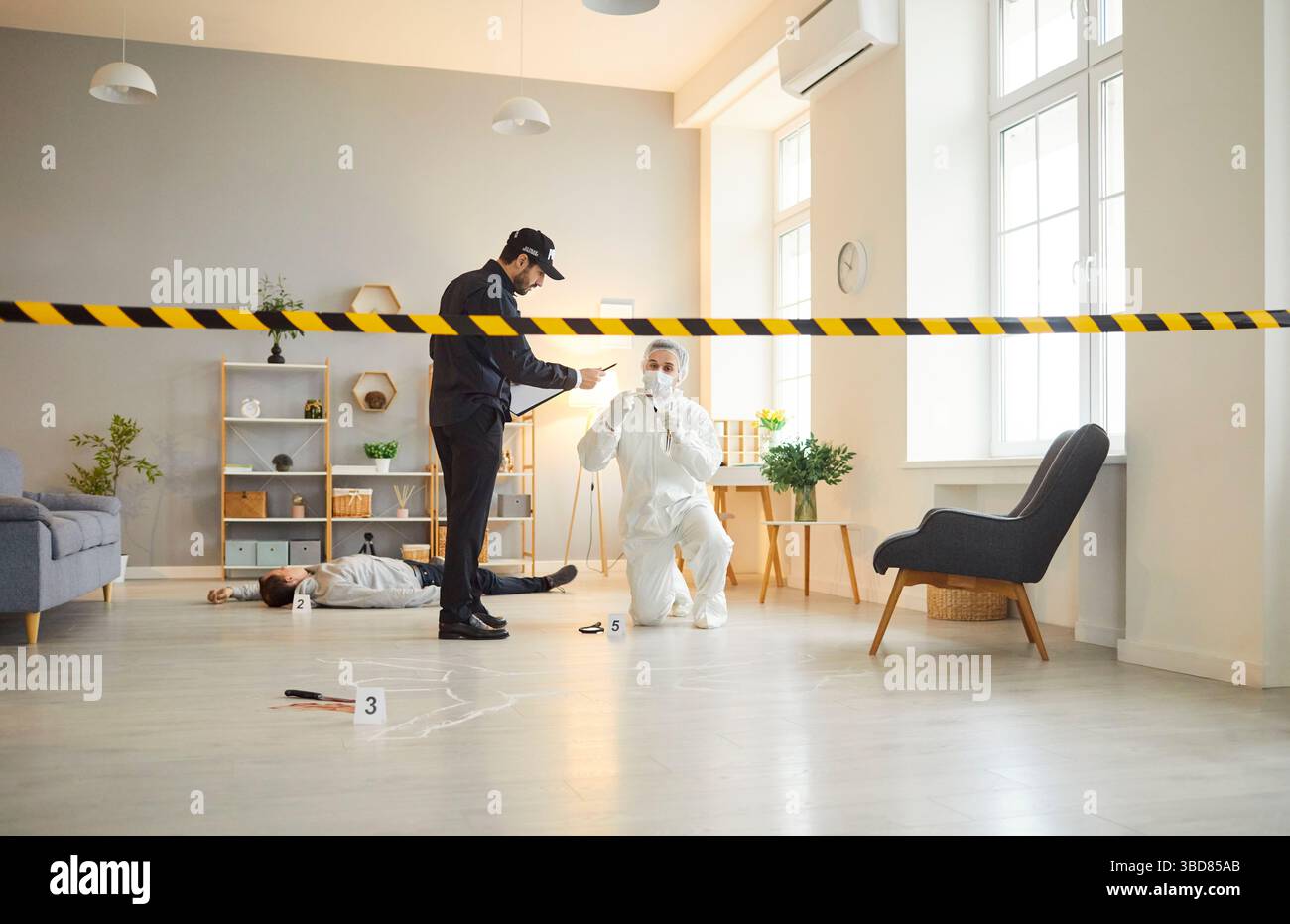 Forensic expert and police officer gathering clues and recording ...