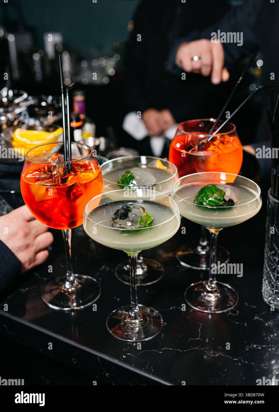 Colorful cocktails including Aperol spritz and citrus drinks with herb ...
