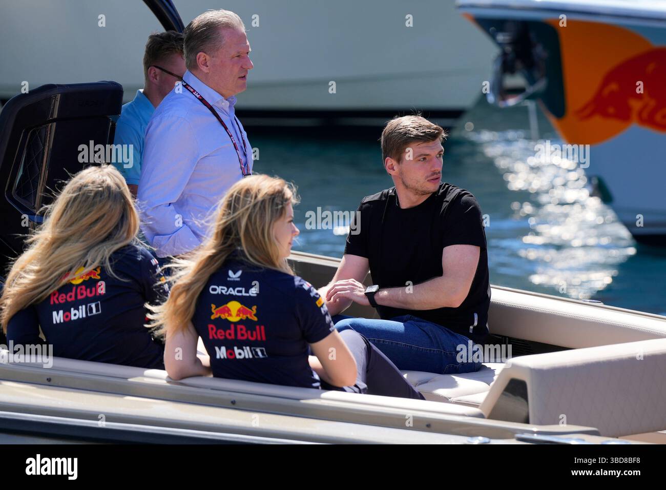 Red Bull driver Max Verstappen, right, of the Netherlands, arrives on a ...