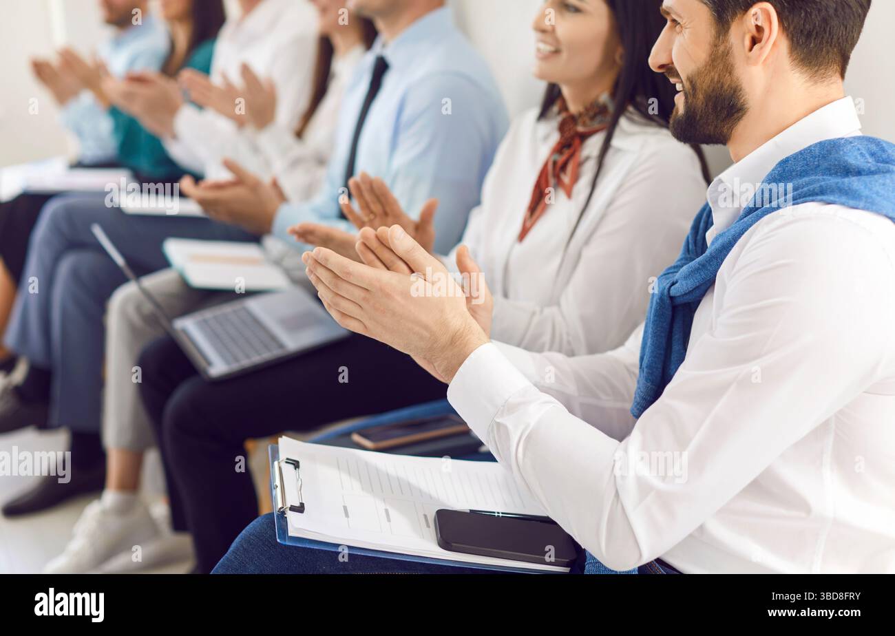 Smart business audience office people group smiling applauding sitting ...