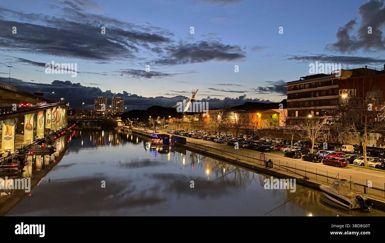 Modern pedestrian bridge Ponte del Mare spanning Pescara River, glowing ...