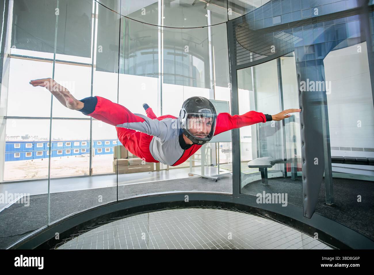 Indoor skydiving experience in a wind tunnel facility Stock Photo - Alamy