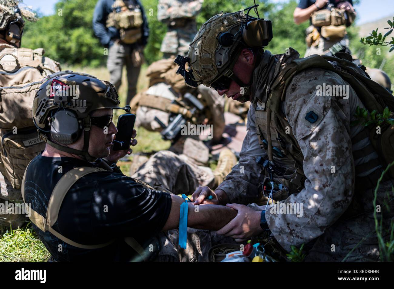 U.S. Navy Petty Officer 3rd Class Iokepa Kaeka, right, a corpsman with ...