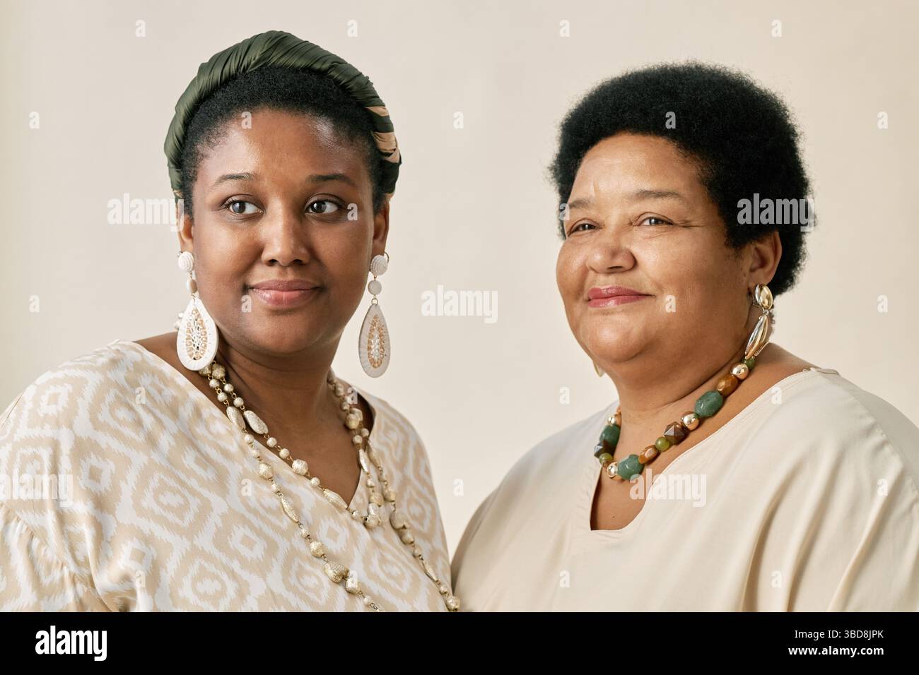 Portrait of two African American women posing together wearing ...