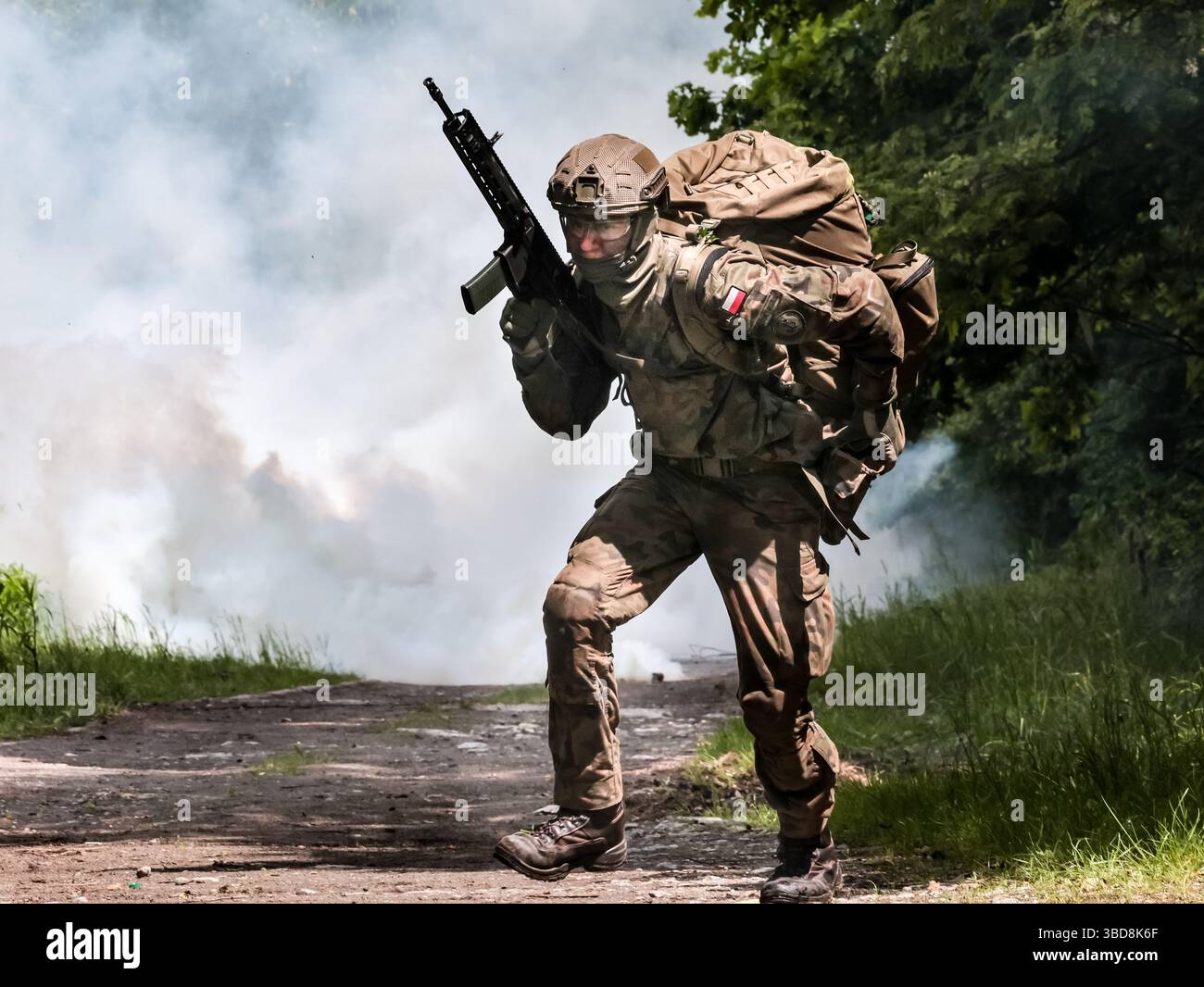 A candidate for Territorial Defence soldier retreats after being ...
