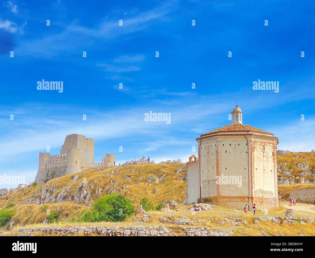 Rocca Calascio medieval fortress towering above octagonal Santa Maria ...