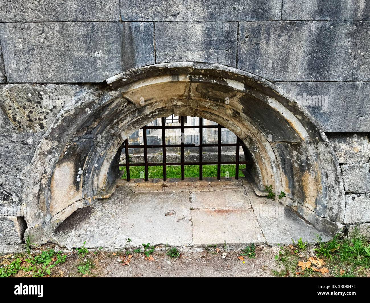 Historic stone archway with metal bars in Tomar Castle, Portugal ...