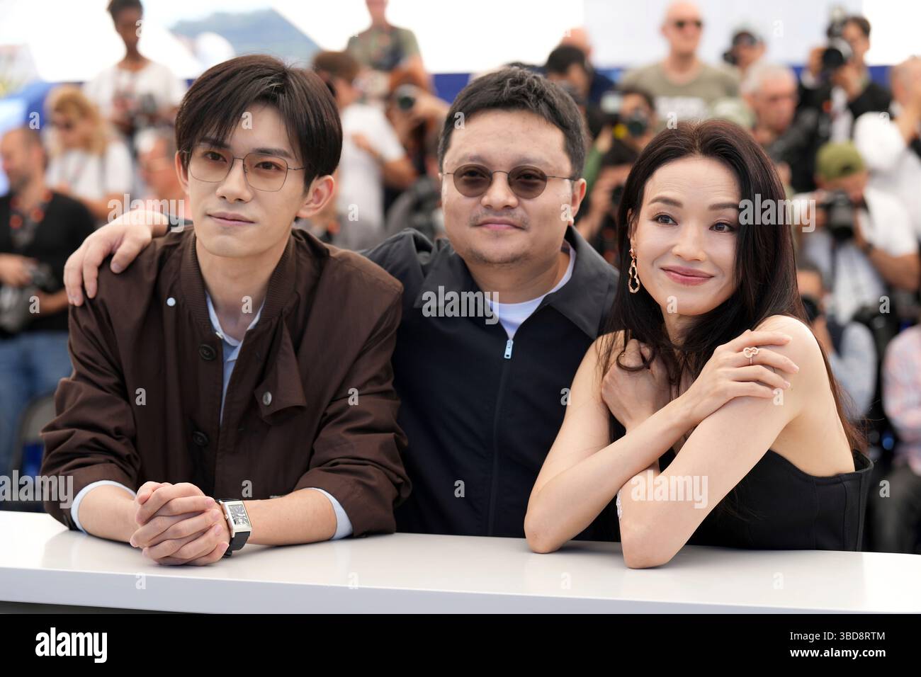 Jackson Yee, from left, director Bi Gan and Shu Qi pose for ...