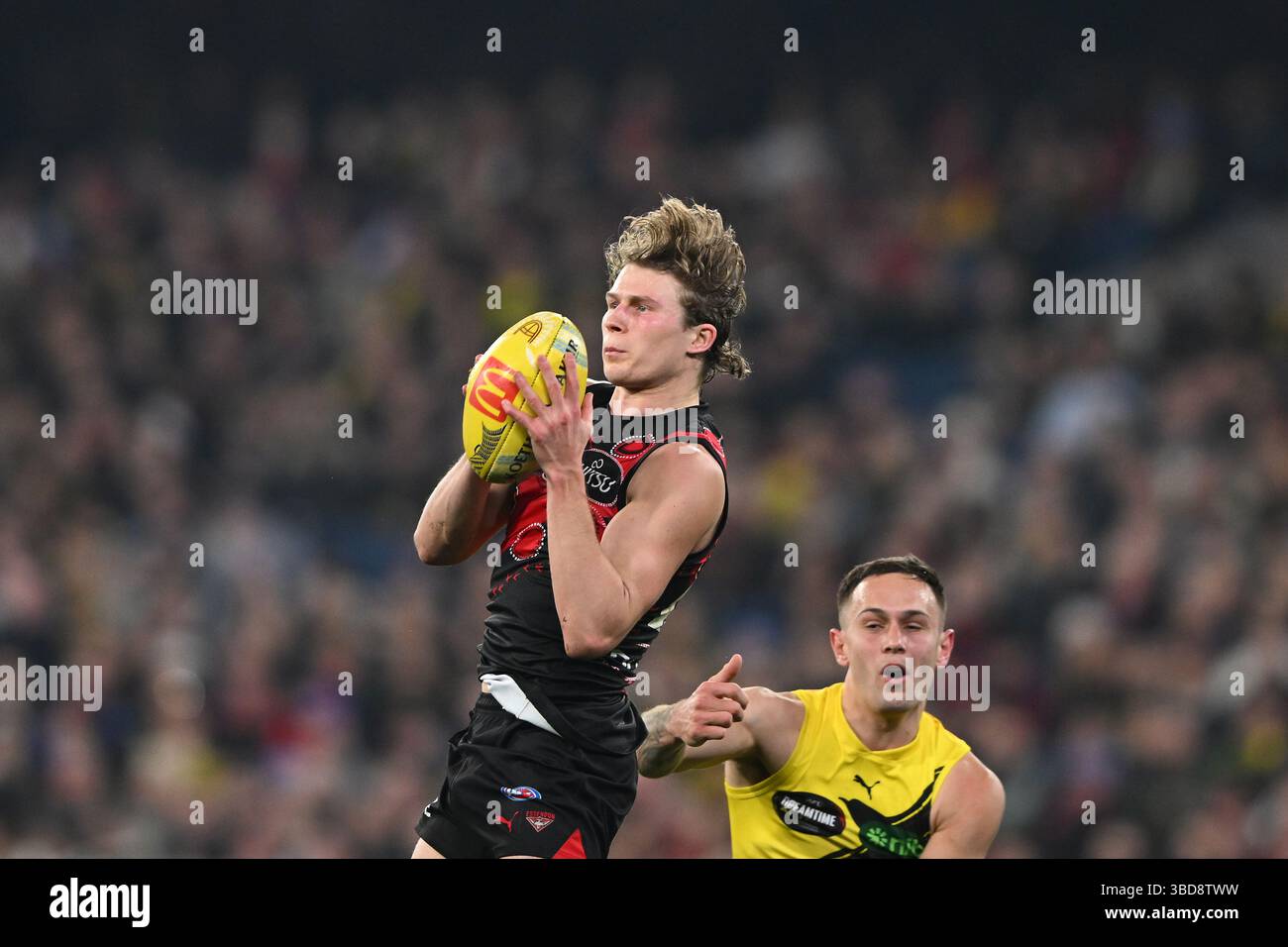 Melbourne, Australia. 23rd May, 2025. Xavier Duursma of Essendon marks ...