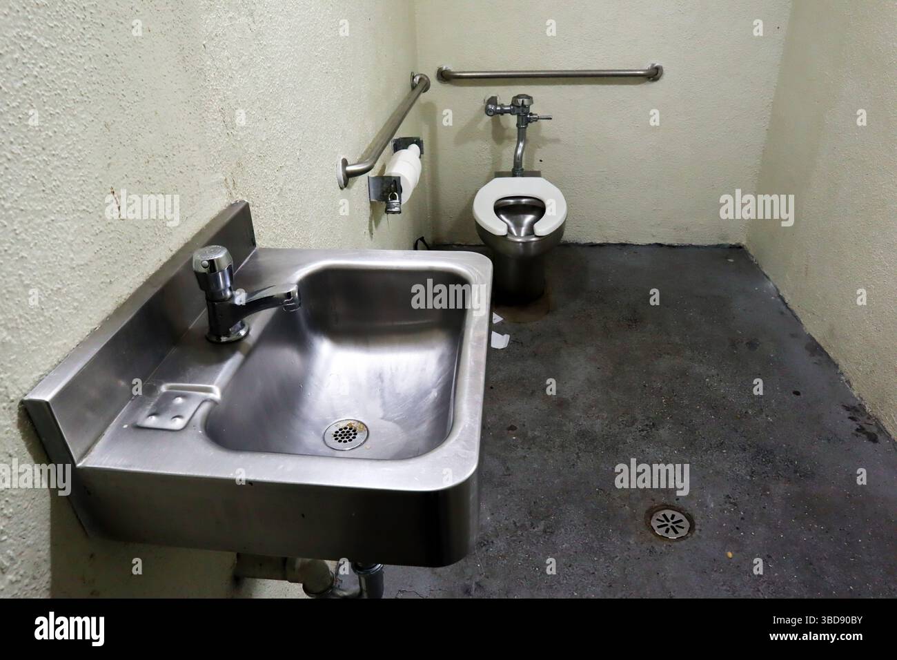 Interior of Public Restroom with Stainless Steel Fixtures and ...