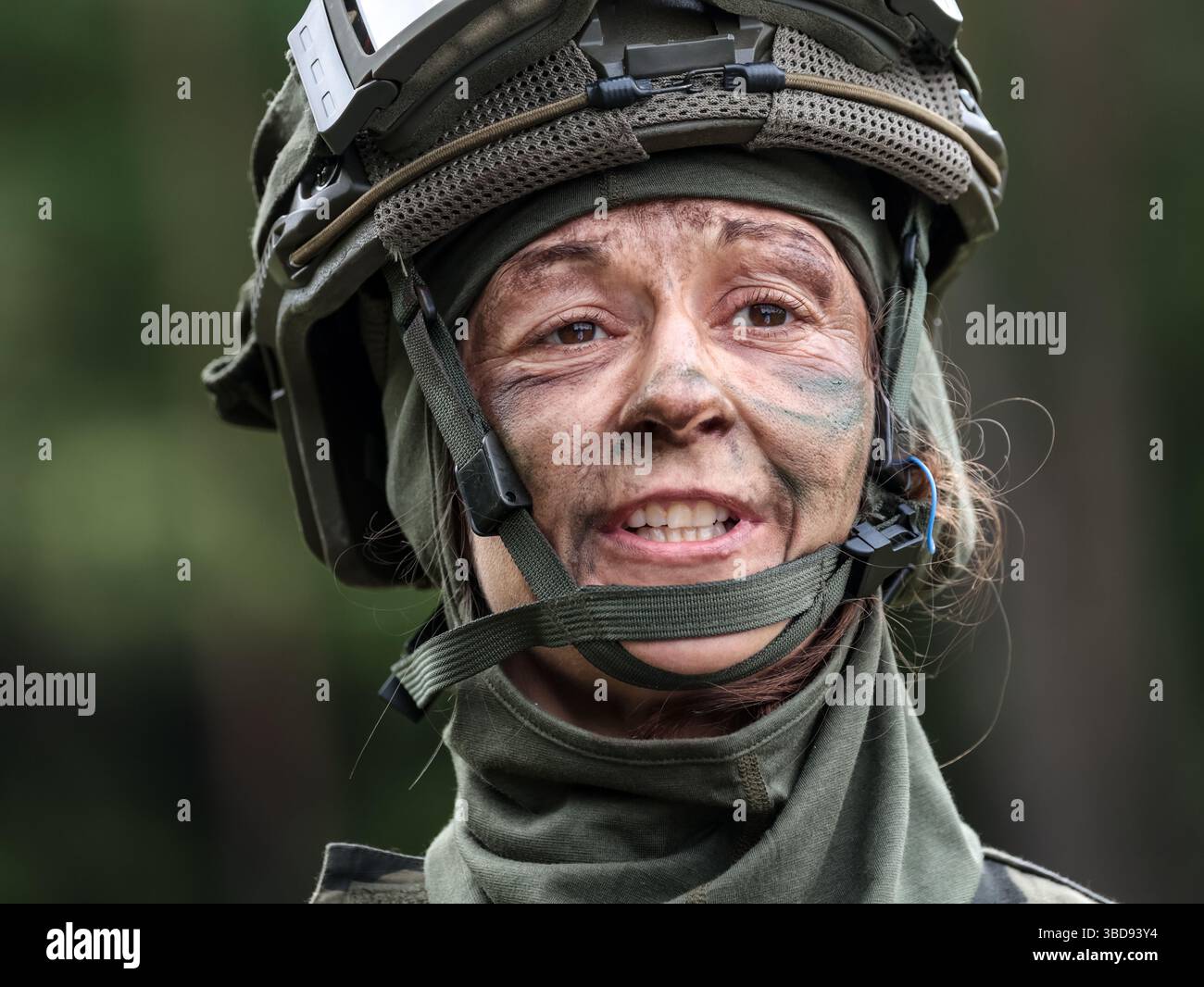 A female candidate for Territorial Defence soldier takes exams after ...