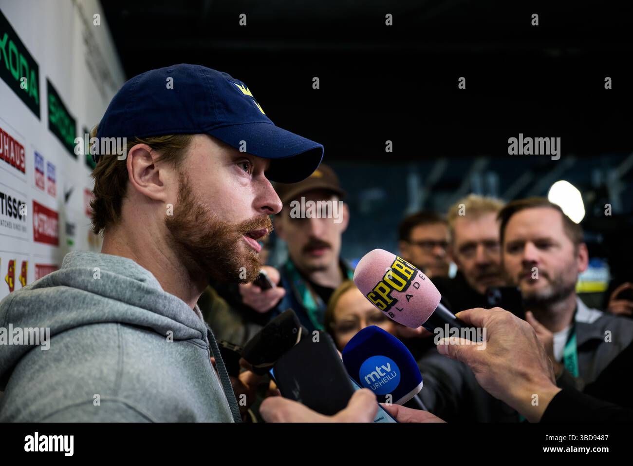 Adam Larsson of, Sweden. , . is being interviewed by media at a ...