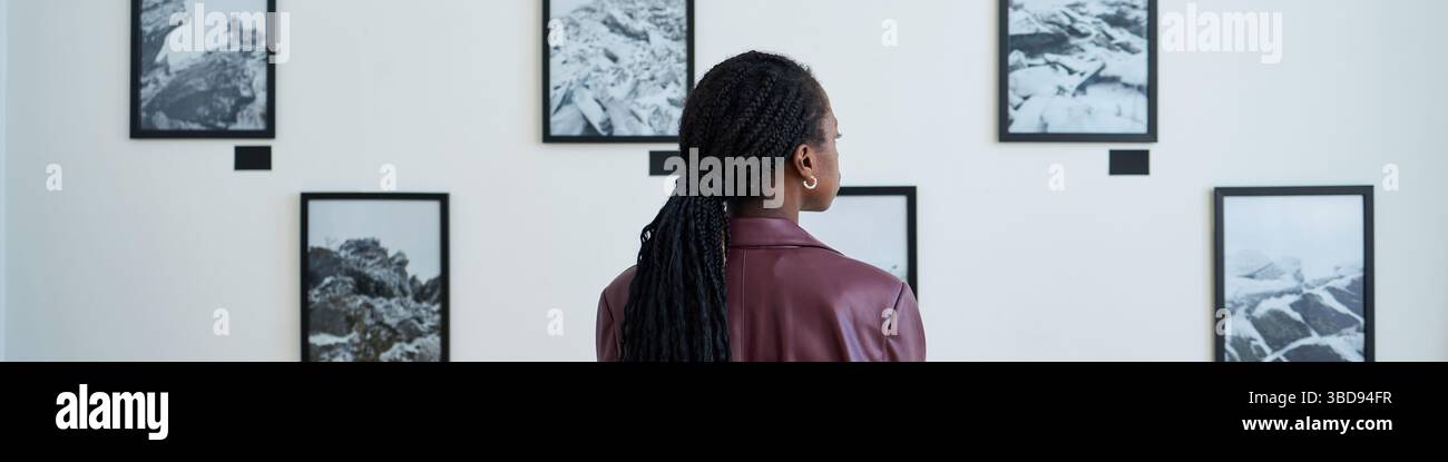 Header with woman with long braids facing black-and-white photograph ...