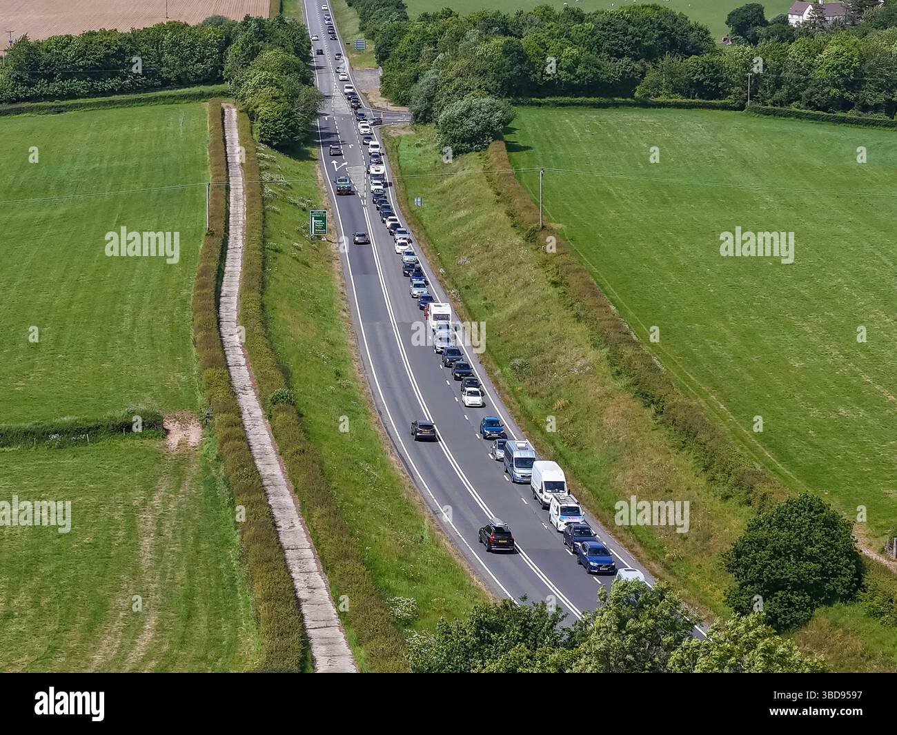 Axminster, Devon, UK. 23rd May 2025. UK Weather. Huge queues stretching ...
