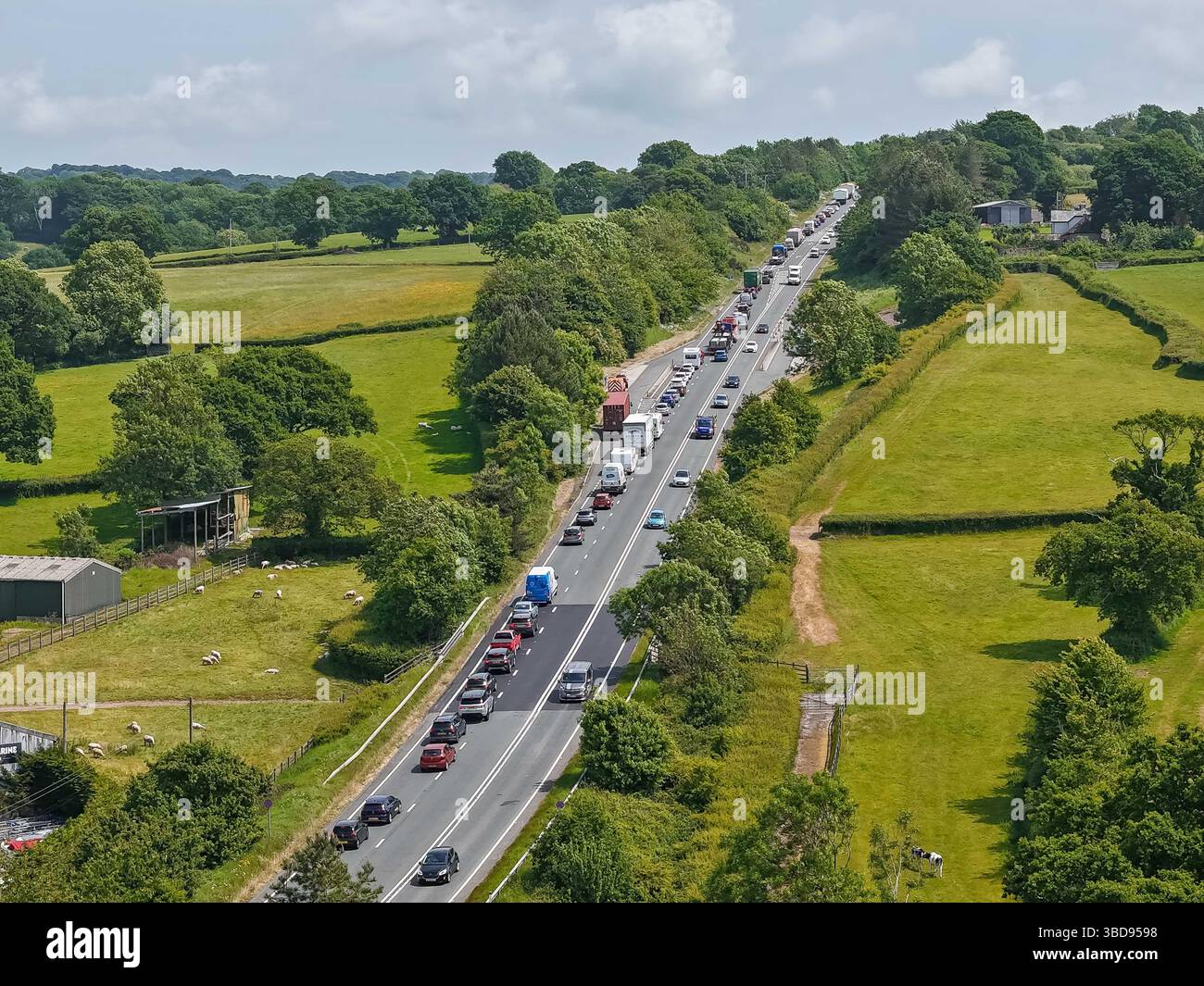 Axminster, Devon, UK. 23rd May 2025. UK Weather. Huge queues stretching ...