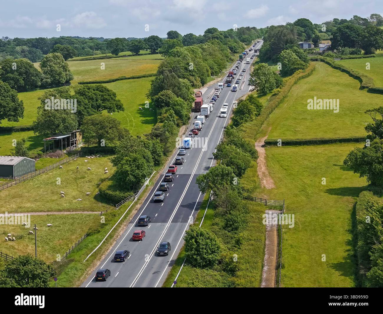 Axminster, Devon, UK. 23rd May 2025. UK Weather. Huge queues stretching ...