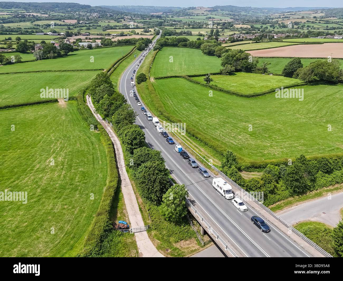 Axminster, Devon, UK. 23rd May 2025. UK Weather. Huge queues stretching ...
