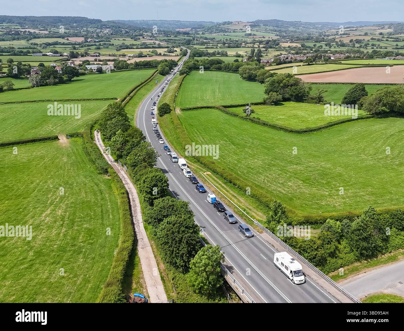 Axminster, Devon, UK. 23rd May 2025. UK Weather. Huge queues stretching ...
