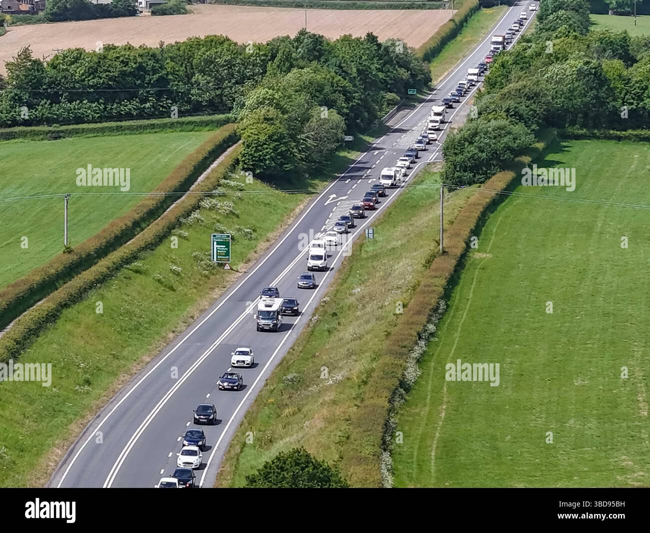 Axminster, Devon, UK. 23rd May 2025. UK Weather. Huge queues stretching ...