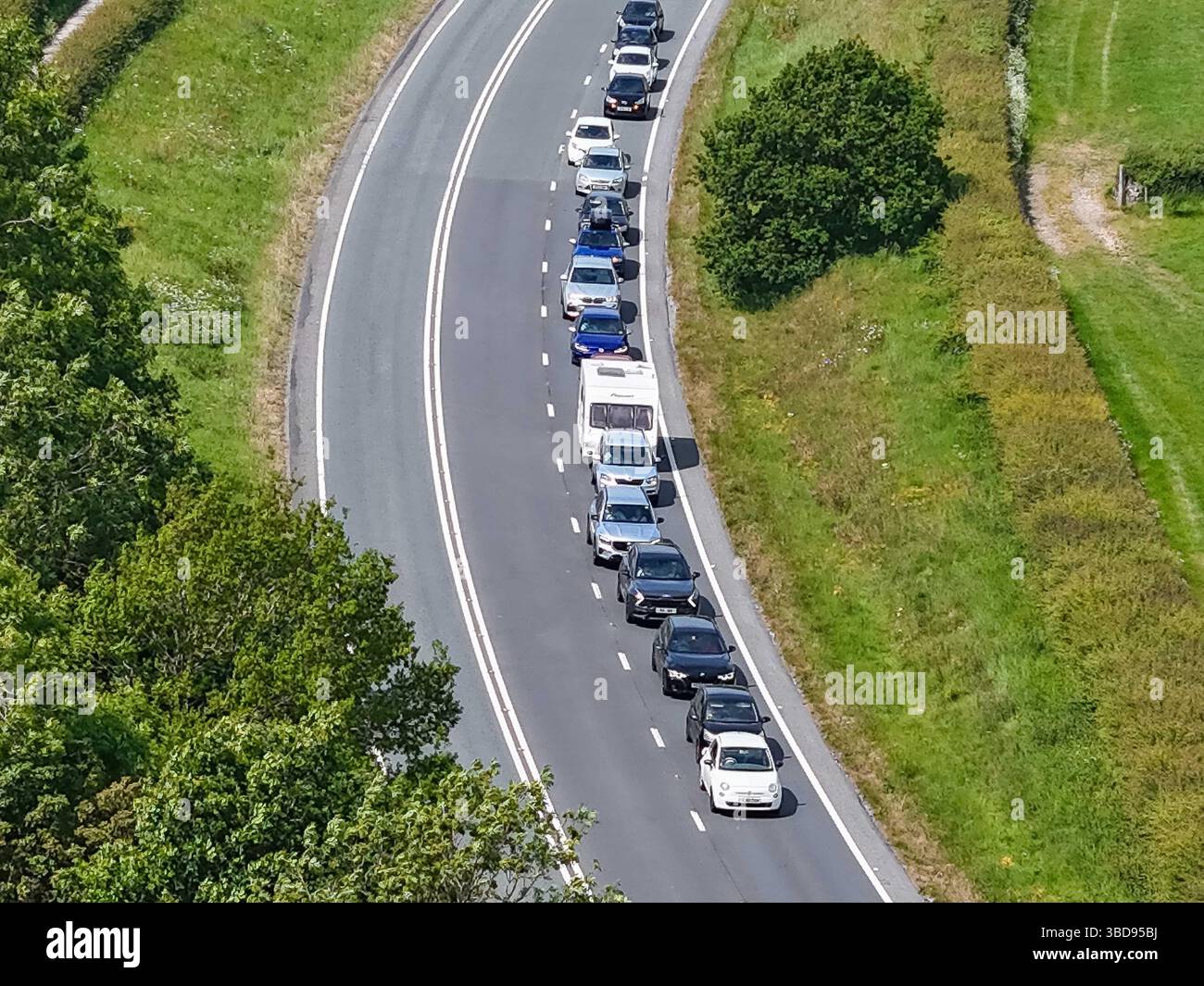 Axminster, Devon, UK. 23rd May 2025. UK Weather. Huge queues stretching ...