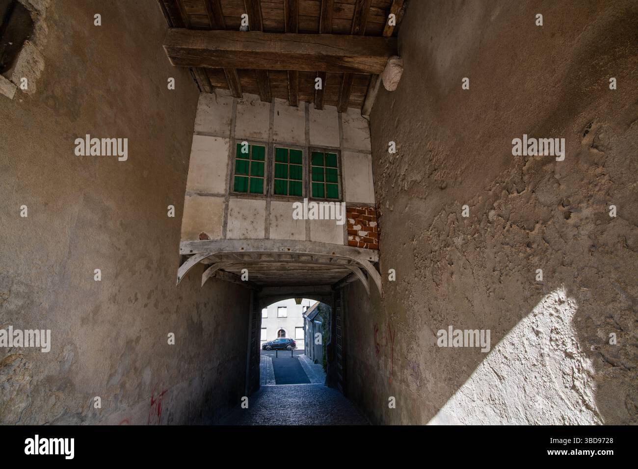 Historic Stone Passageway with Timber-Framed Overhang in Beaugency ...