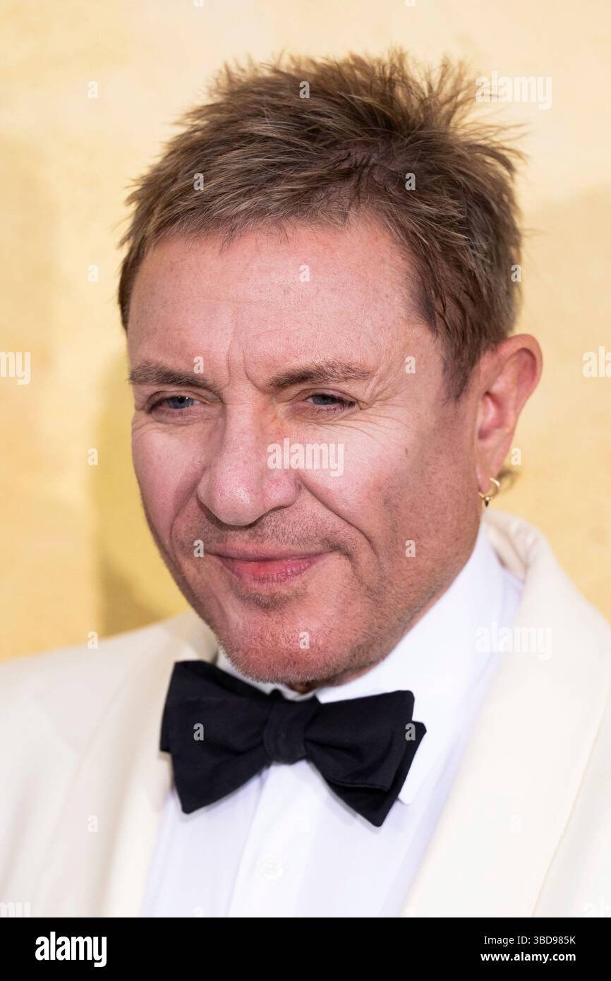 Simon Le Bon poses for photographers upon arrival at the amfAR Cinema ...