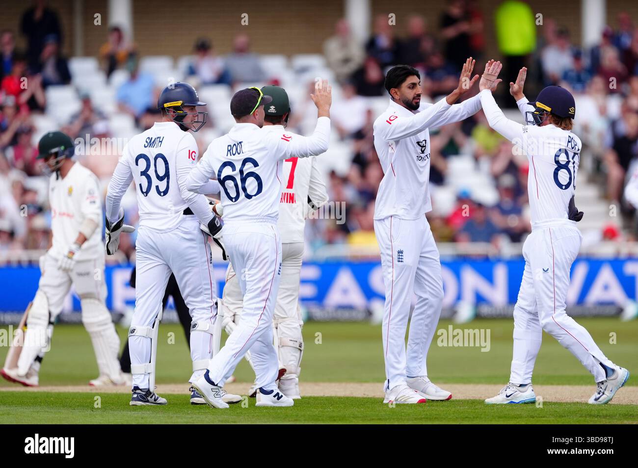 England's Shoaib Bashir (second right) celebrates the wicket of ...