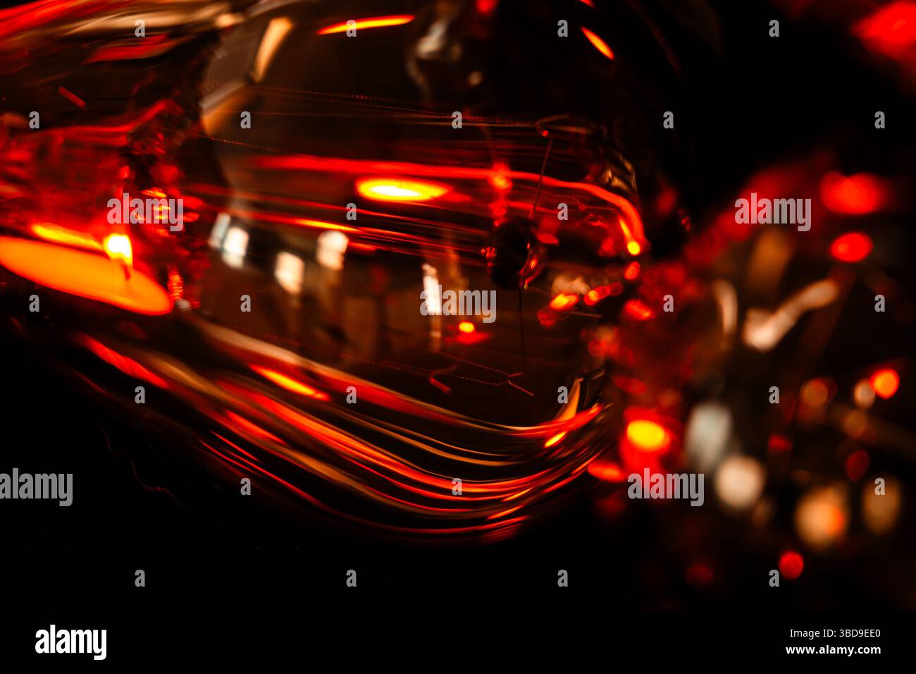Macro image of filaments inside edison bulb in warm light Stock Photo ...