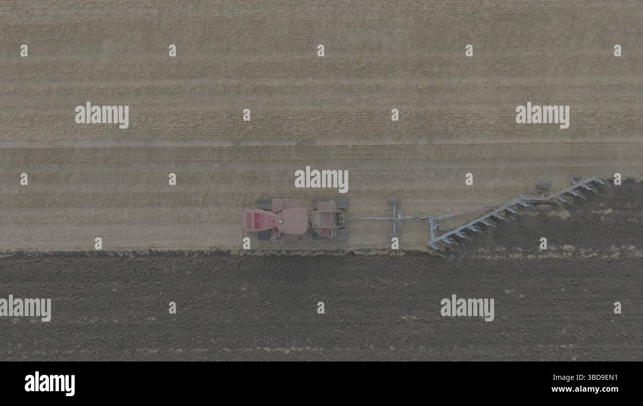 Big red tractor on on rubber tracks, Pulling productive reverse plow on ...