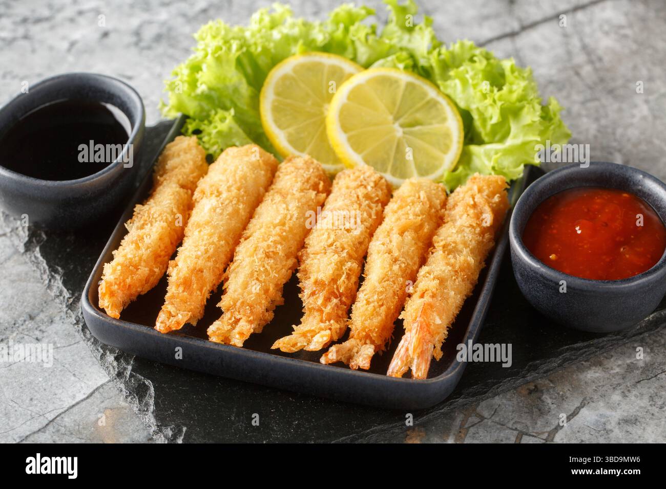 Japanese king prawns tempura served with lemon and lettuce and two ...