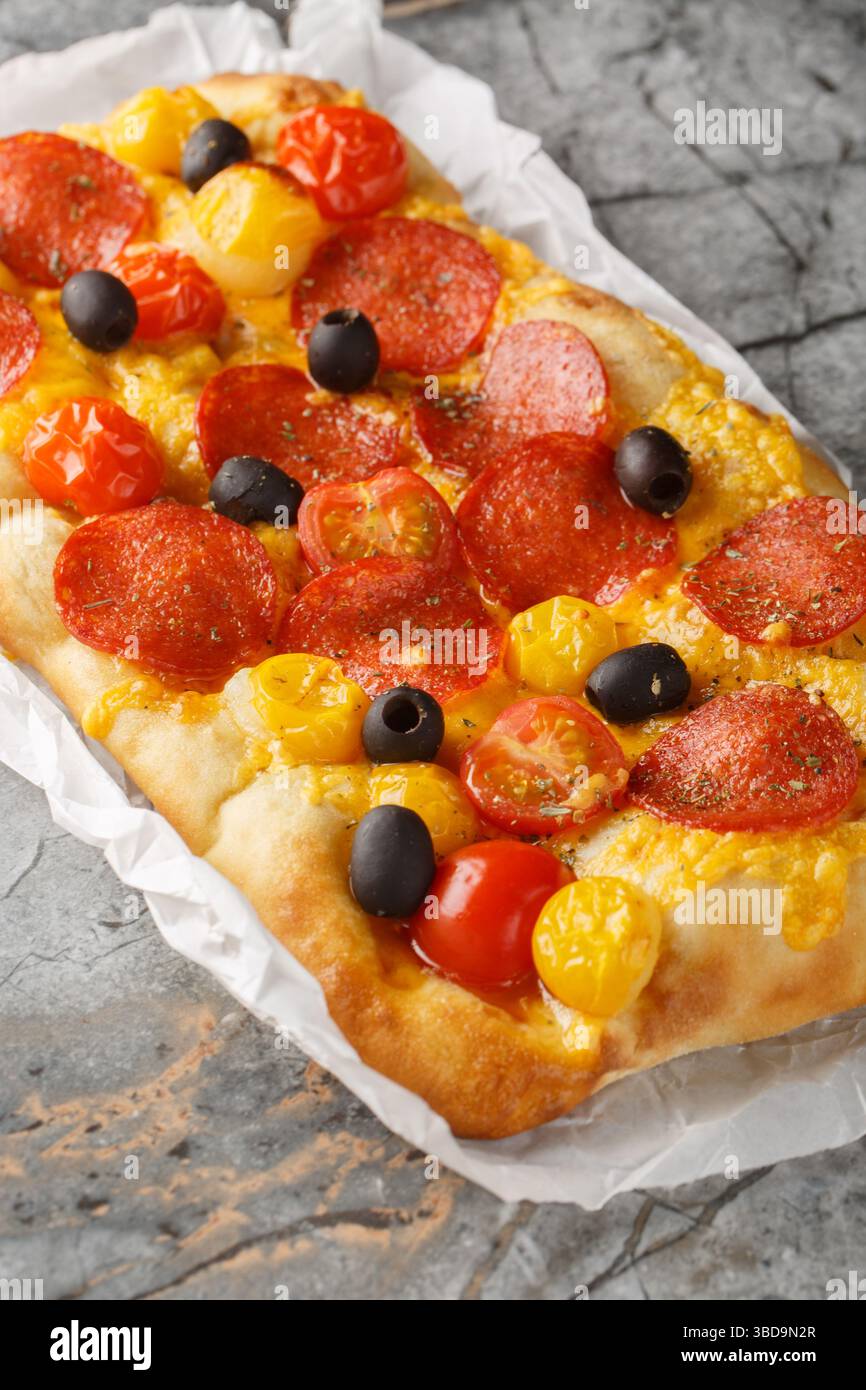 Pinsa Romana with cherry tomatoes, peperoni sausage, olive cheddar ...