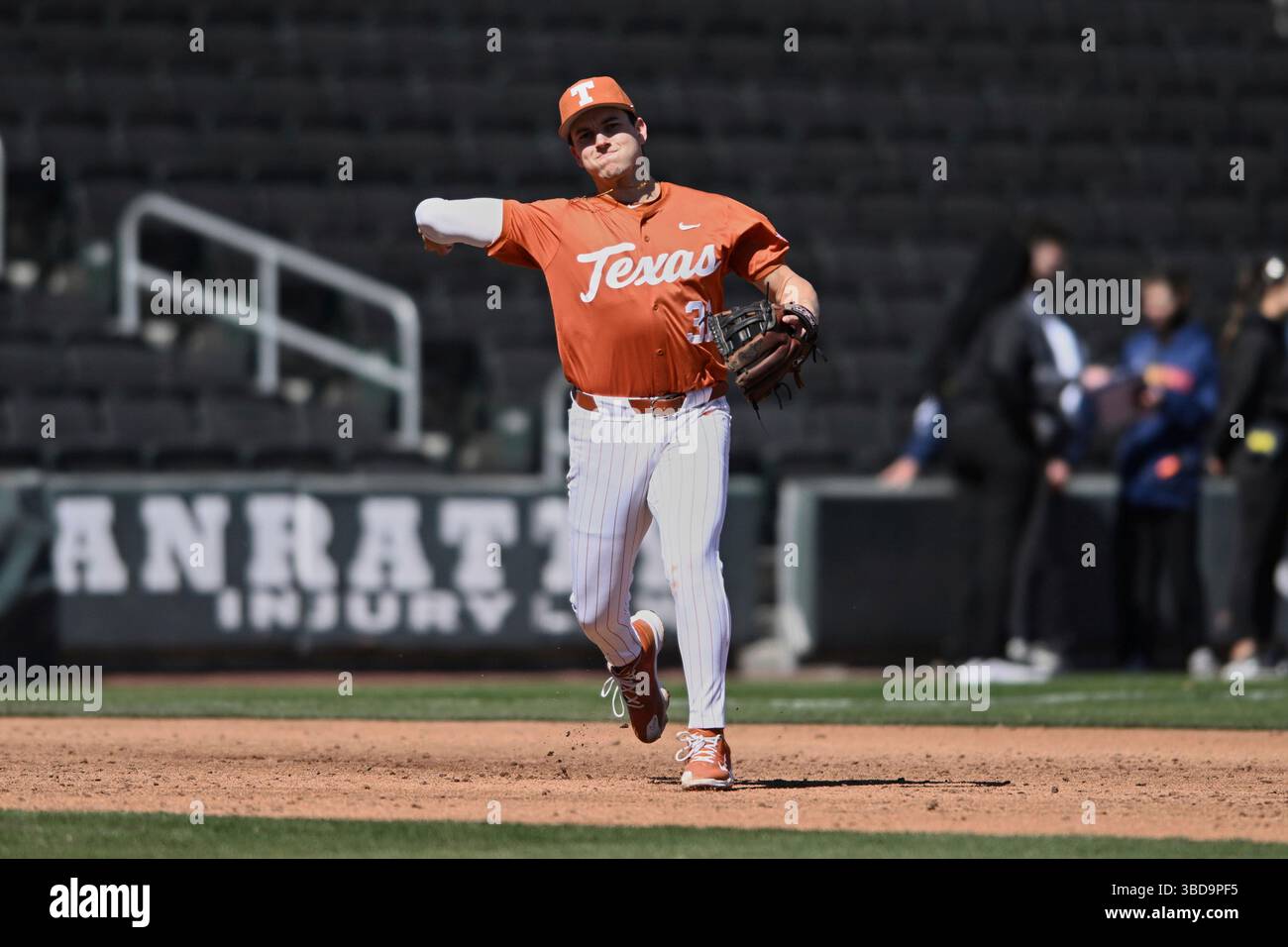 Texas Longhorns third baseman Casey Borba (31) throws to first base ...