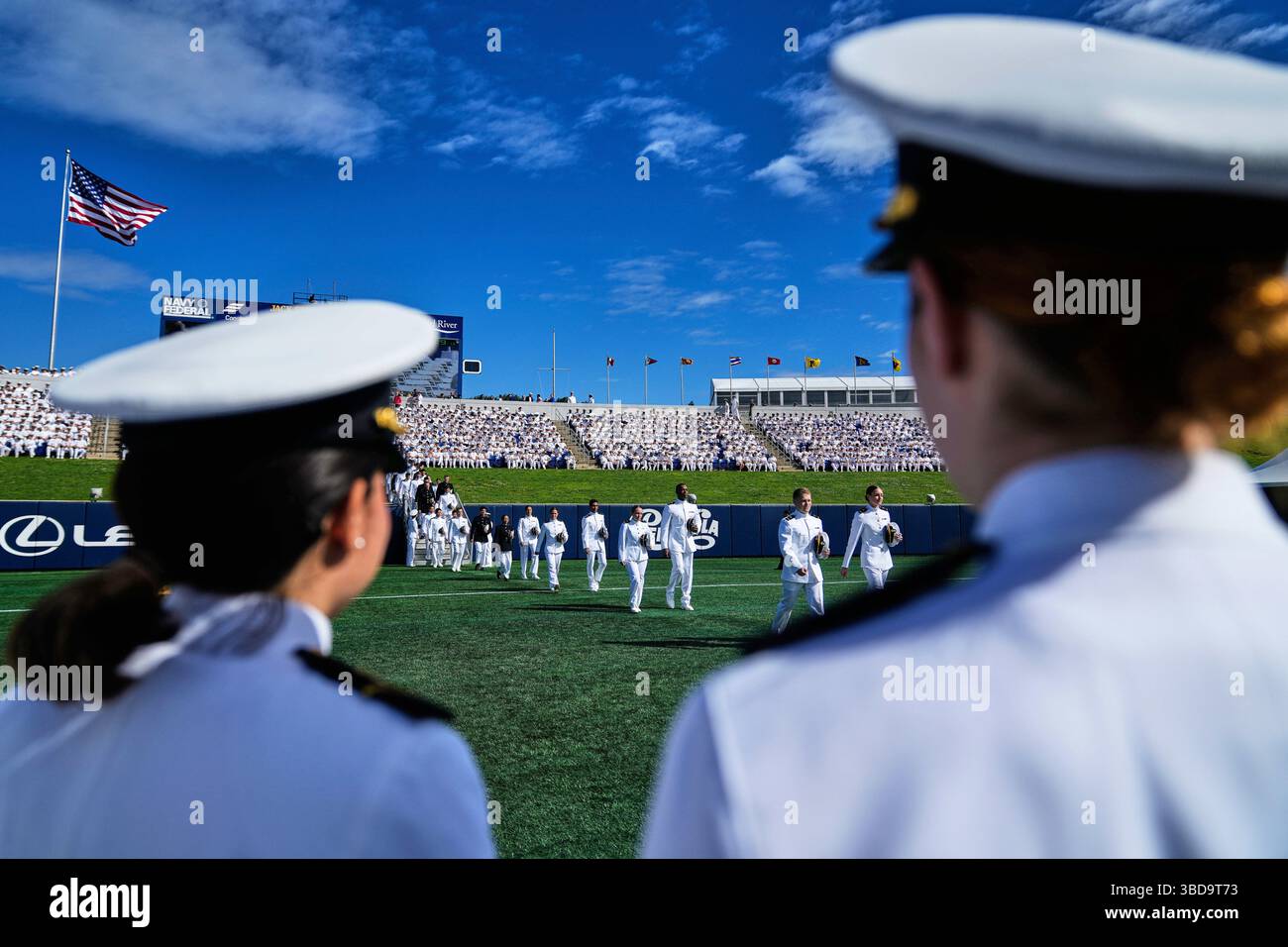 U.S. Naval Academy graduates arrive during the procession of the U.S ...