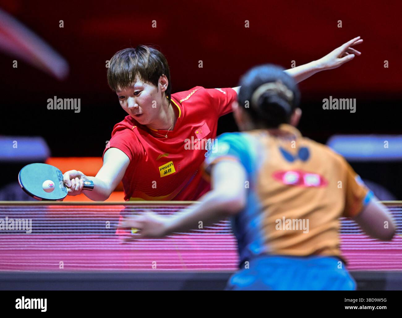 Doha, Qatar. 23rd May, 2025. Wang Manyu (L) hits a return during the ...