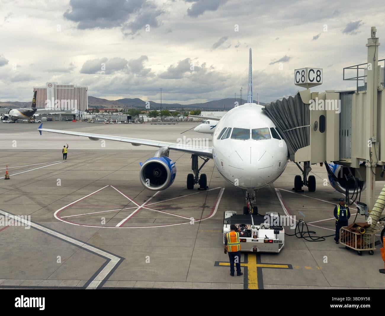23 MAY 2025 - Reno, USA - A plane and ground crew loading with a ...