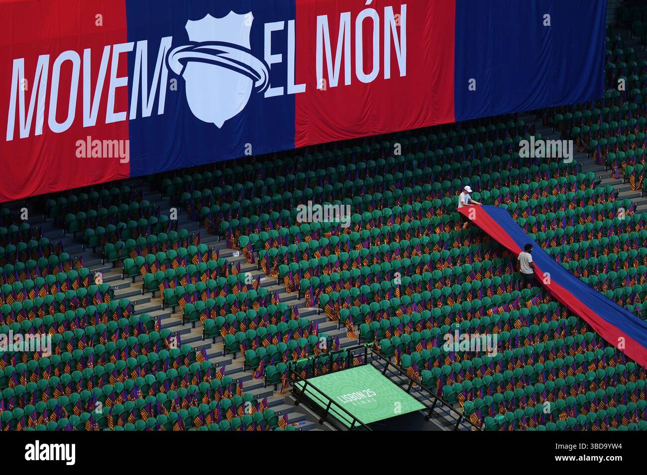 Workers holds a banner with the colors of Barcelona prior their ...
