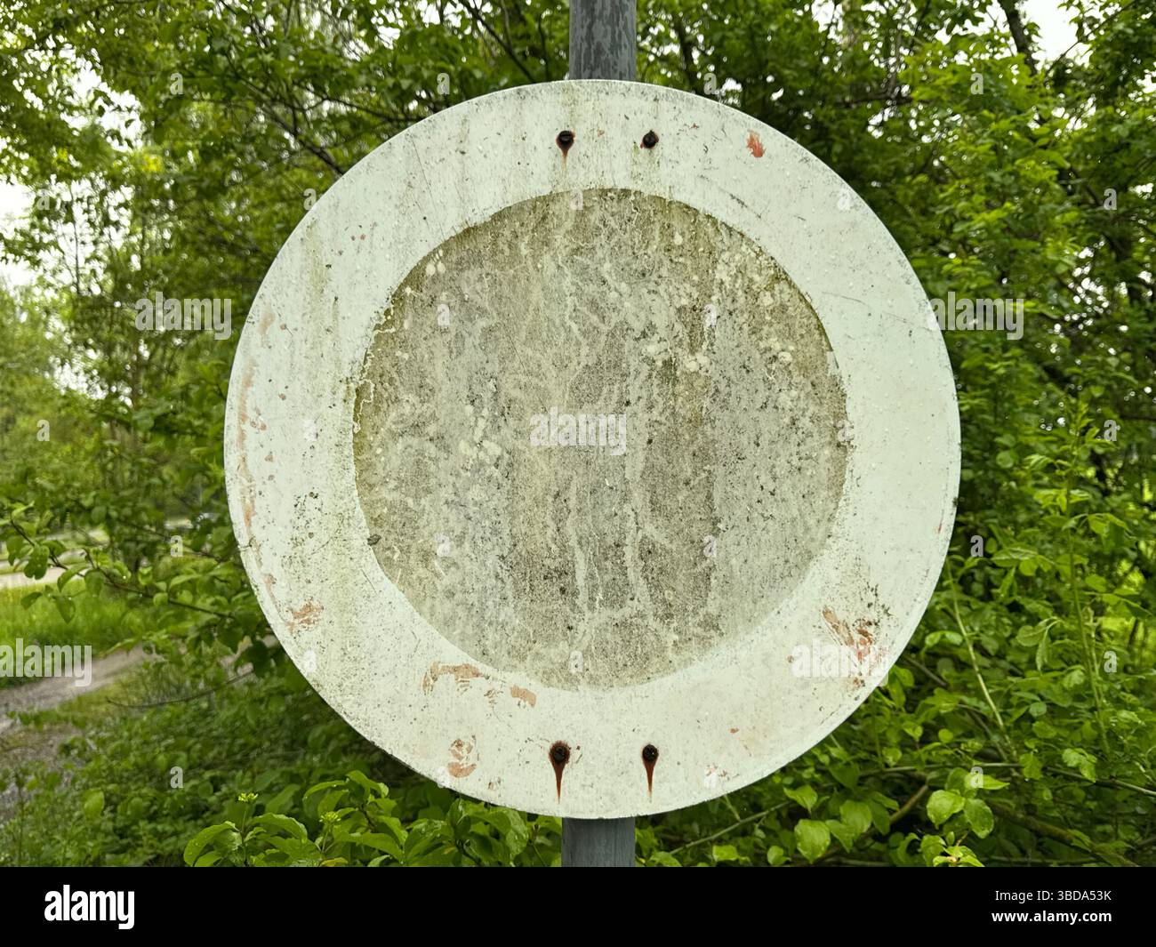 White sign with a hole in the middle Stock Photo - Alamy