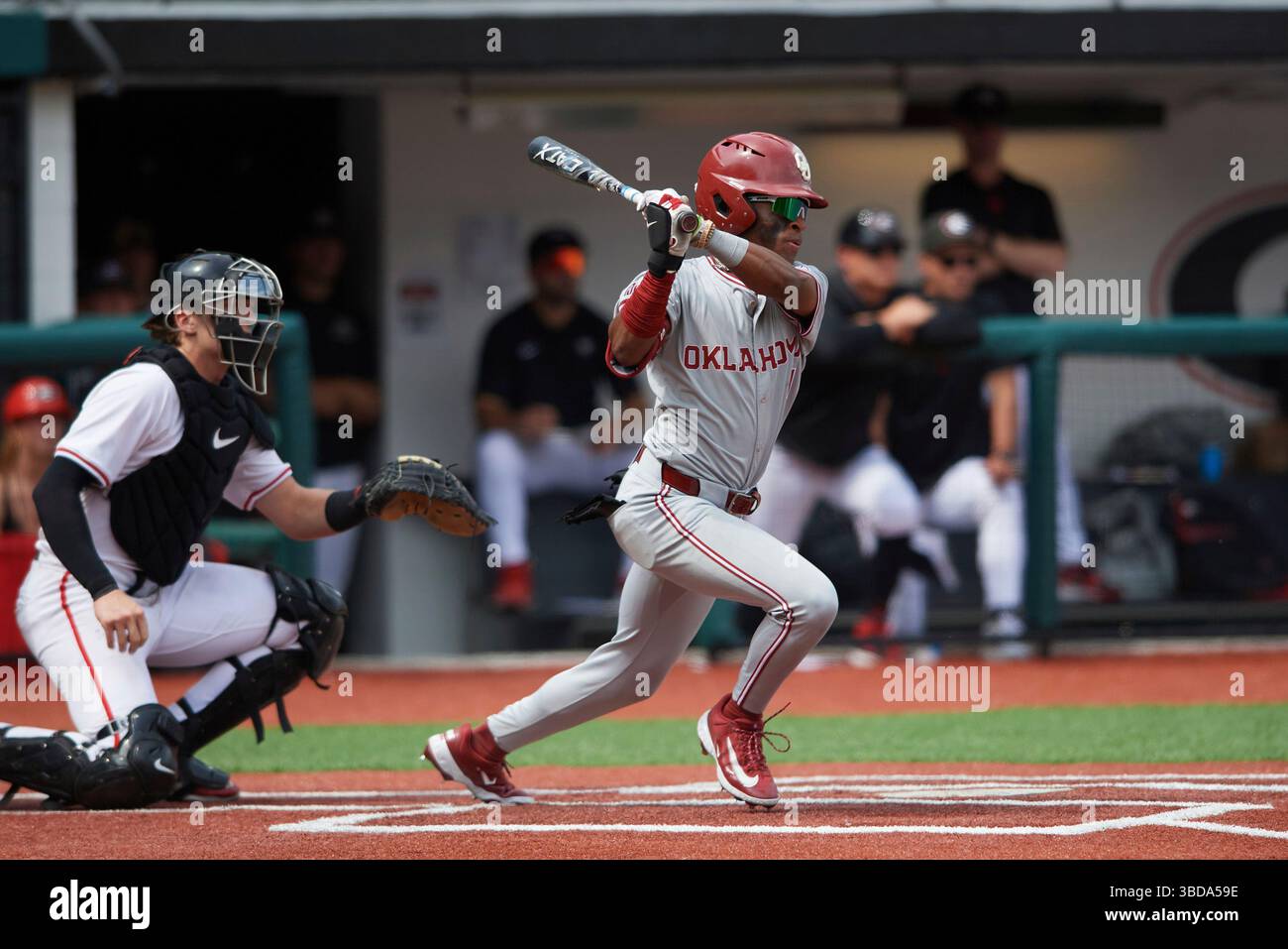 Jason Walk (1) of the Oklahoma Sooners follows through on a swing ...