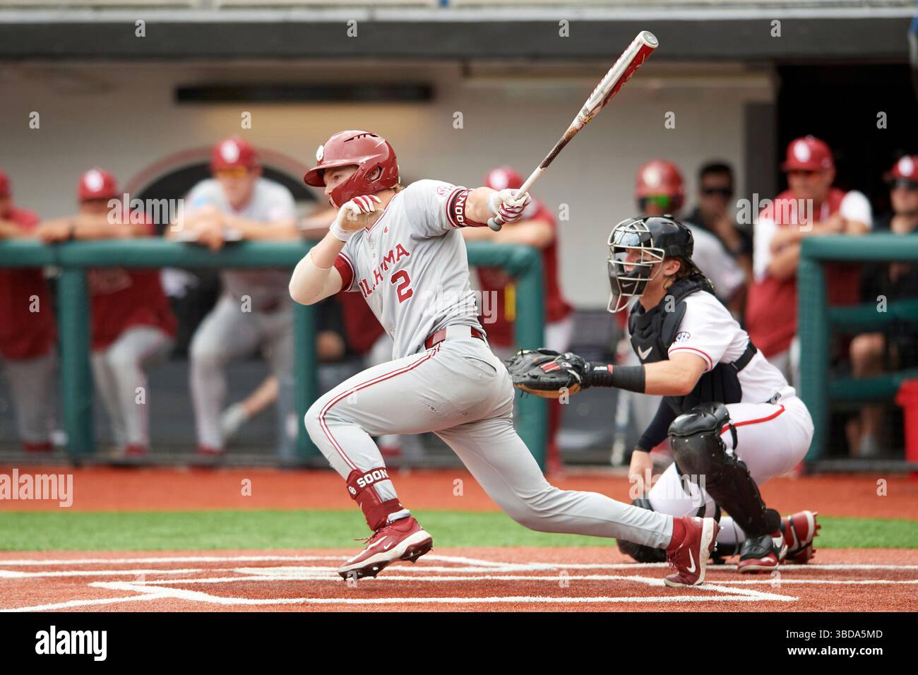 Easton Carmichael (2) of the Oklahoma Sooners follows through on a ...