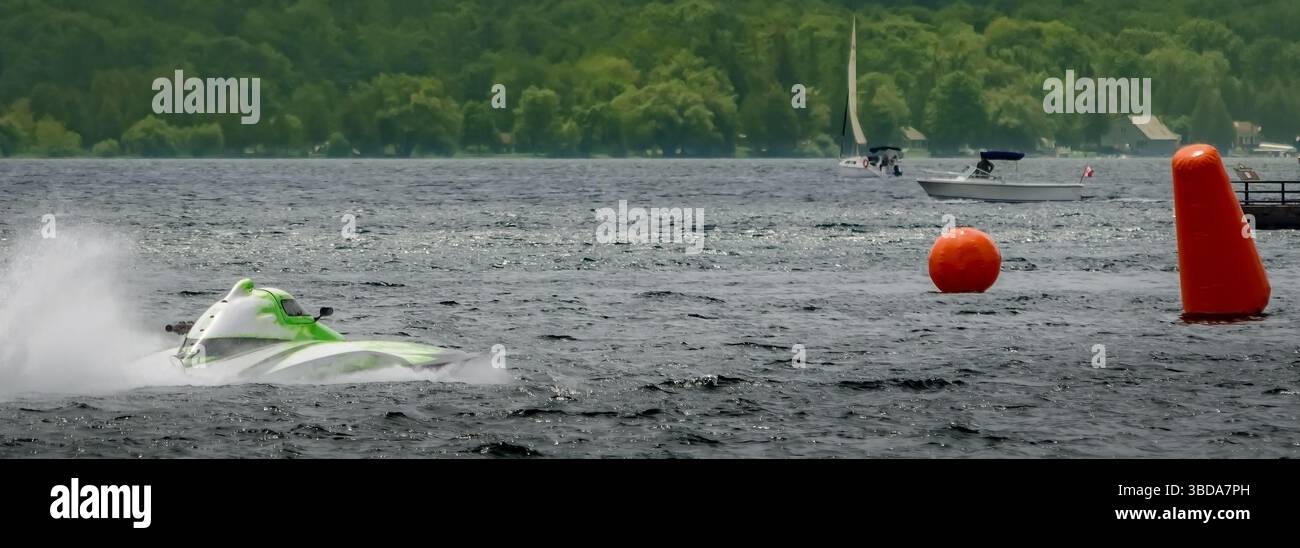 Panorama of a hydroplane racing boat nearing some course bouy's with ...