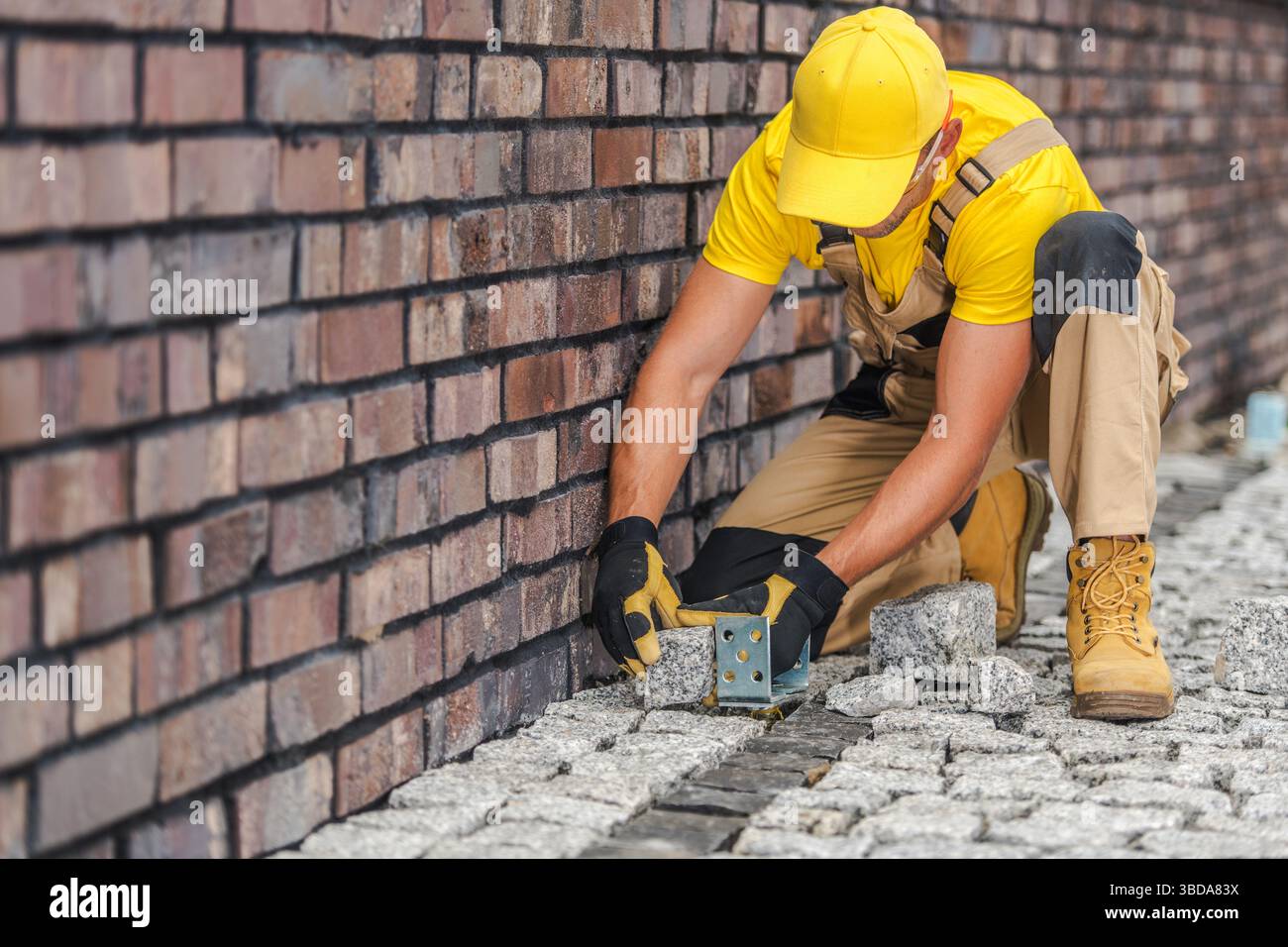 Worker kneels on ground hi-res stock photography and images - Alamy